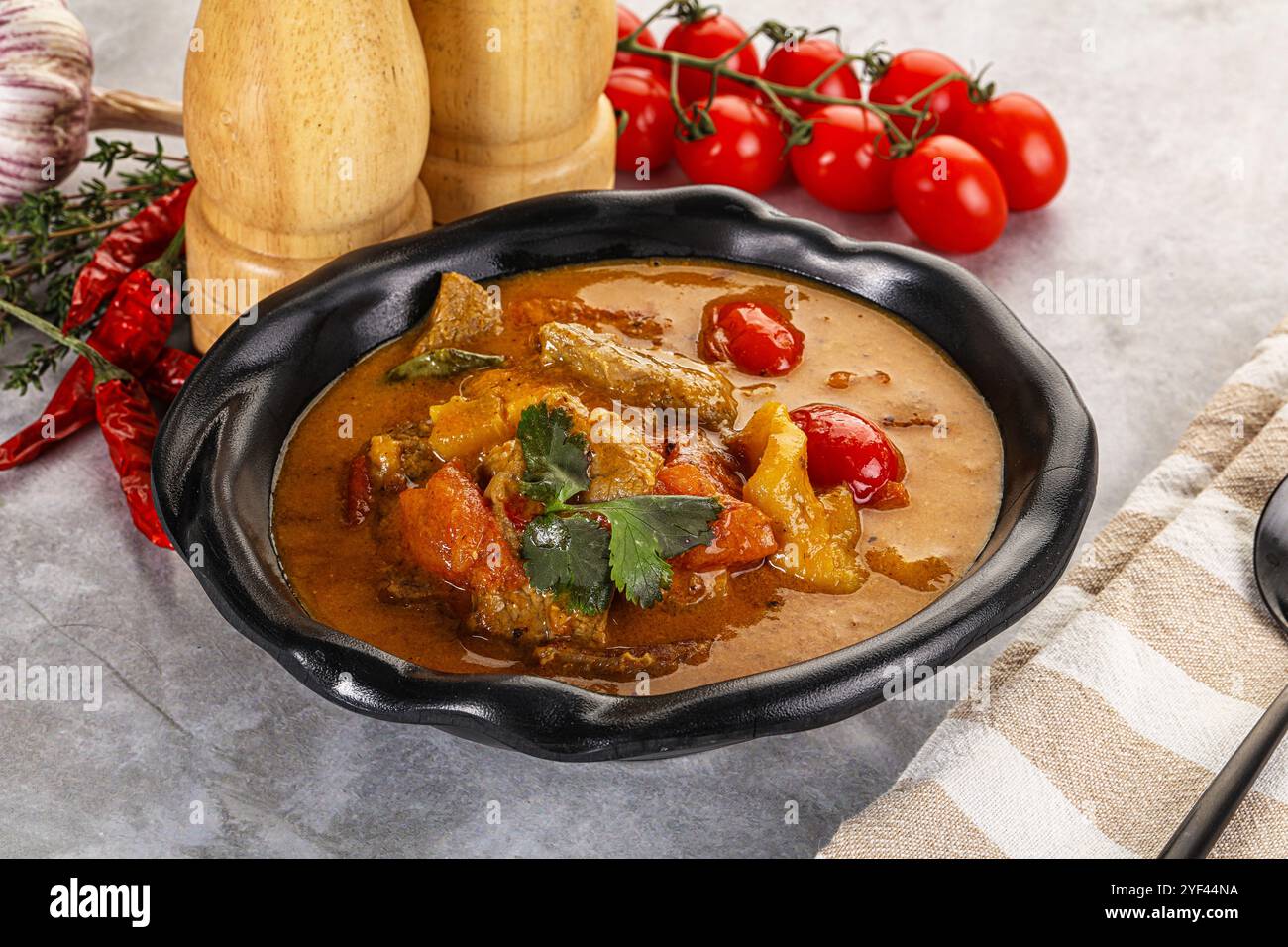 Yellow Thai curry soup with beef Stock Photo - Alamy