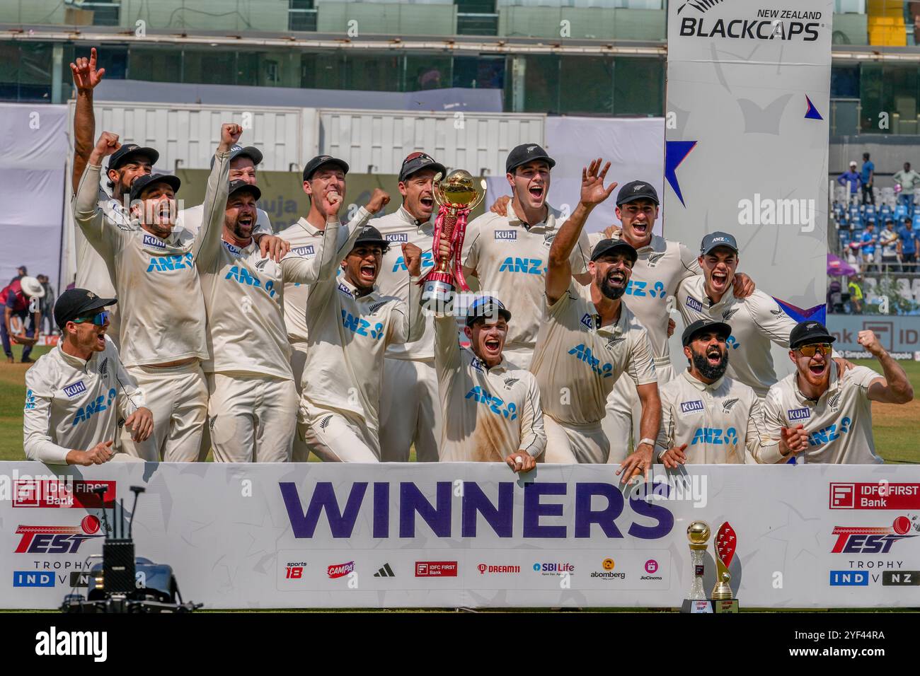 New Zealand's players celebrate with the trophy after winning the three ...
