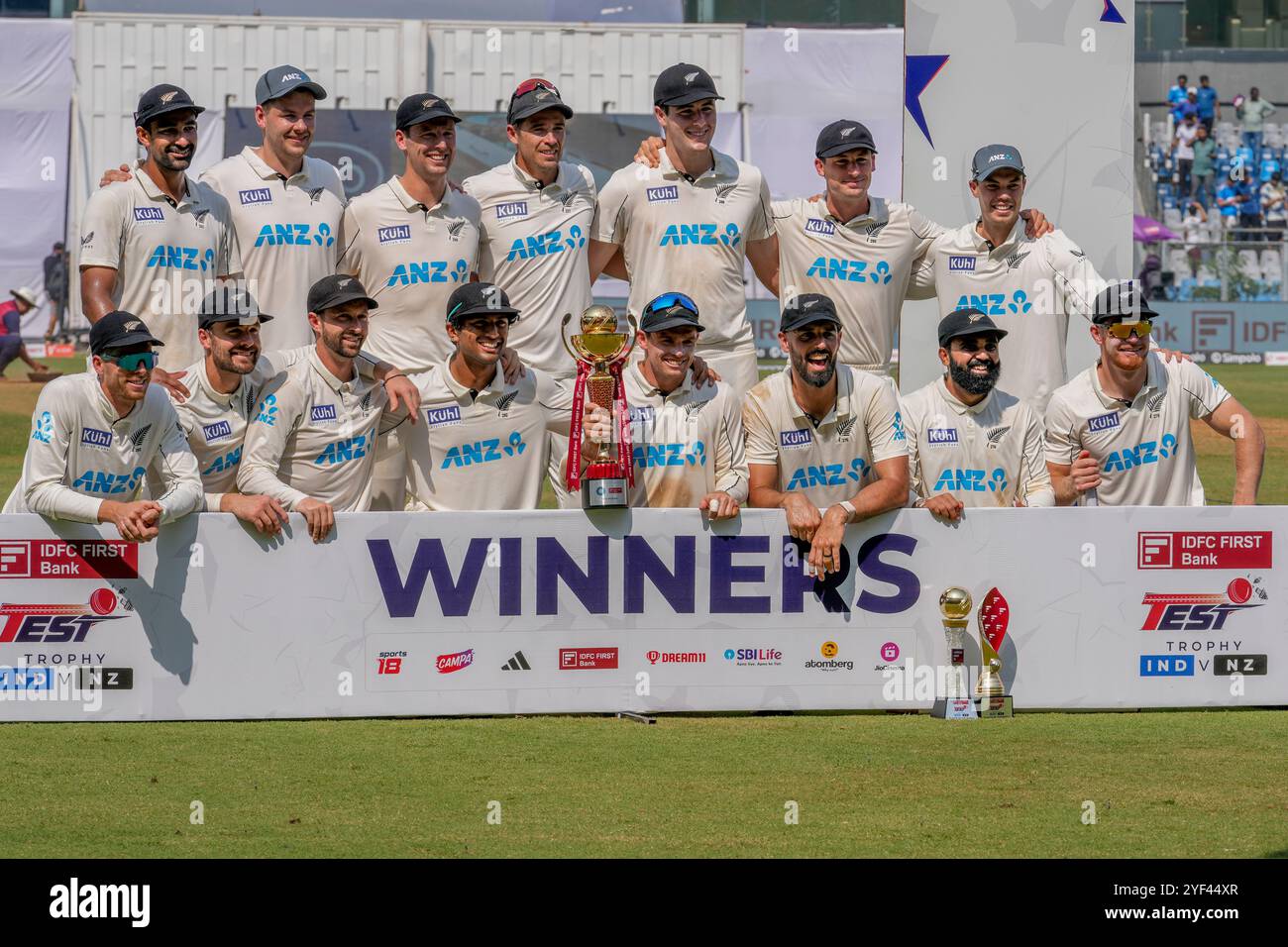 New Zealand's players celebrate with the trophy after winning the three ...