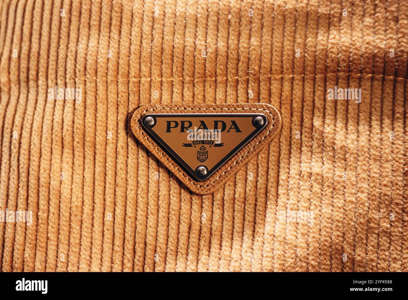 Bologna, Italy - October 6, 2024: Prada enameled metal triangle logo ...