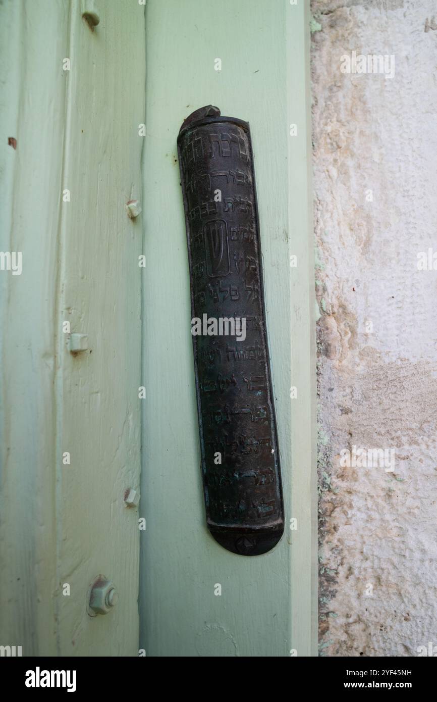 A mezuzah affixed to the doorpost of a home in Jerusalem, Israel. A ...