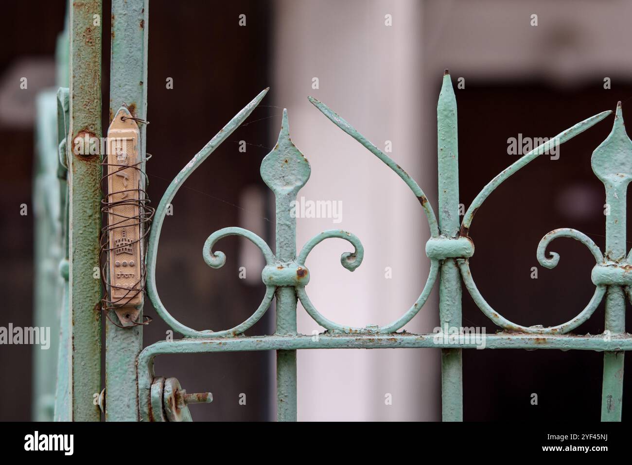 A mezuzah affixed to the metal gate of a home in Jerusalem, Israel. A ...
