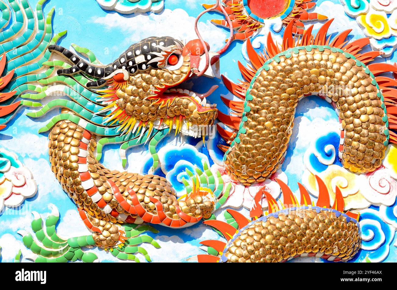 Colorful bas-relief Chinese dragon on the wall Stock Photo - Alamy