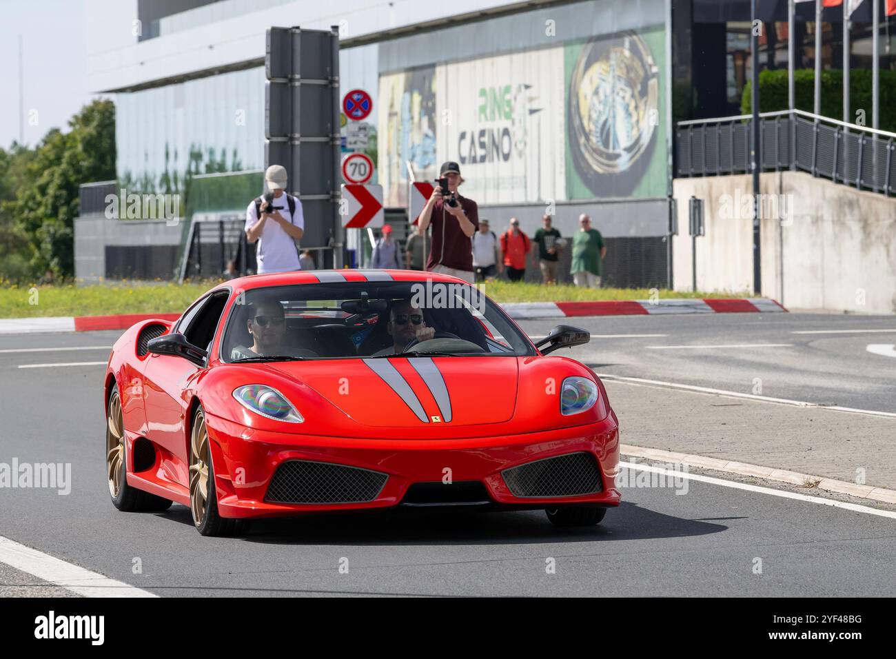 Nürburg, Germany - View on a red Ferrari 430 Scuderia driving on a ...