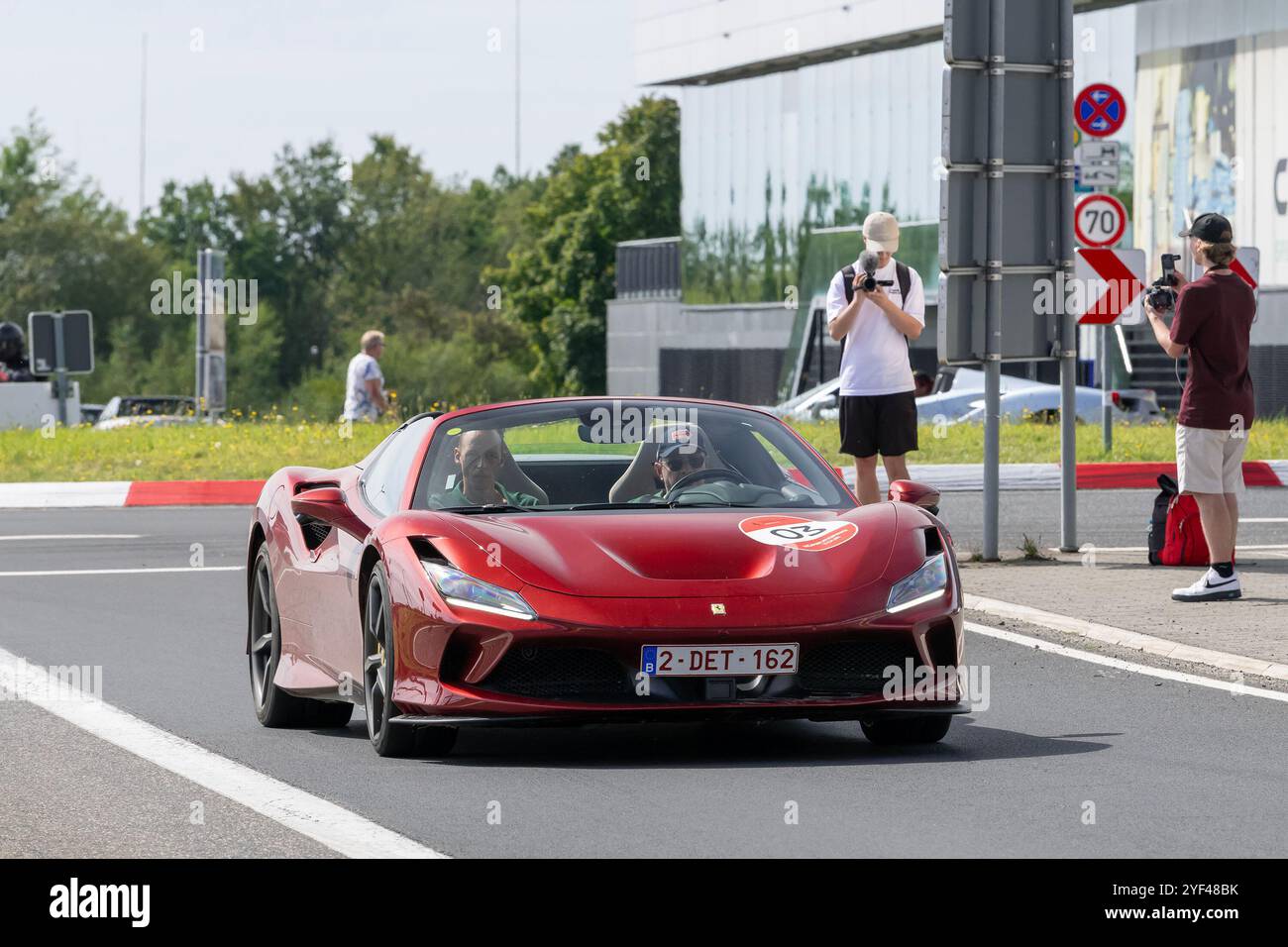 Nürburg, Germany - View on a red Ferrari F8 Spider driving on a street ...