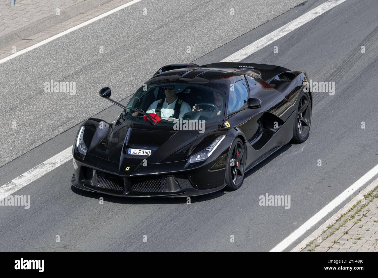 Nürburg, Germany - View on a black Ferrari LaFerrari driving on a ...