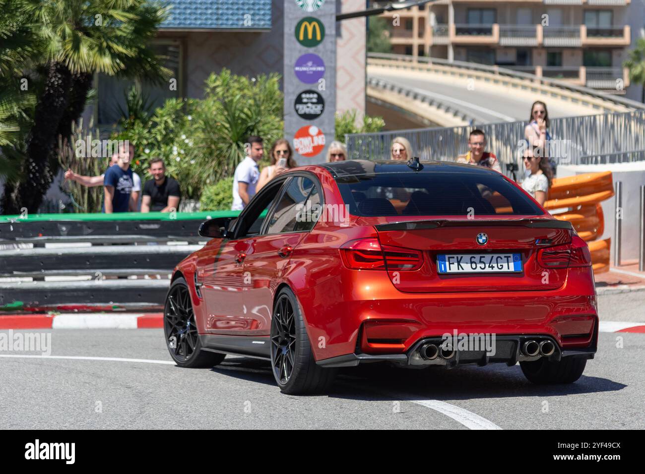 Monte Carlo, Monaco - View on an orange BMW M3 F80 driving on the road ...