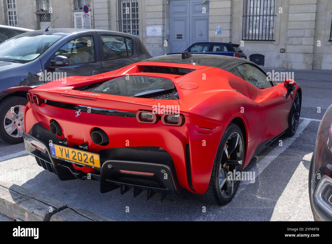 Nancy, France - View on a matte red Ferrari SF90 Stradale driving on a ...