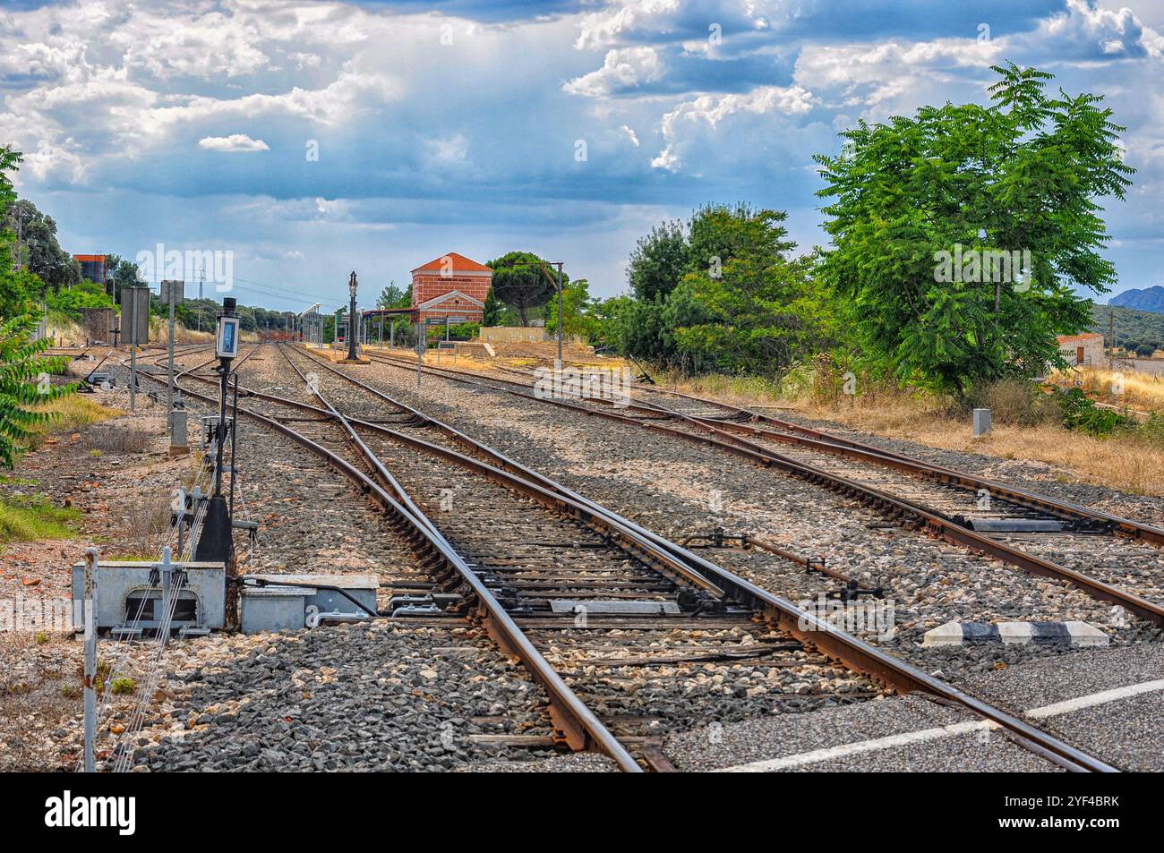 Spanish conventional rail traffic lines and cloudy sky: Almadenejos ...