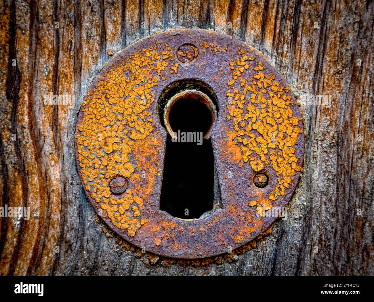 Antique keyhole in Guadalupe, Cáceres. These elements embody the rich ...