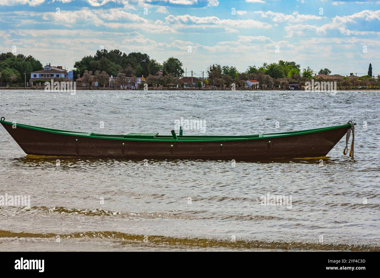 Landscape with small boat of the Villafranca de los Caballeros Lagoon ...