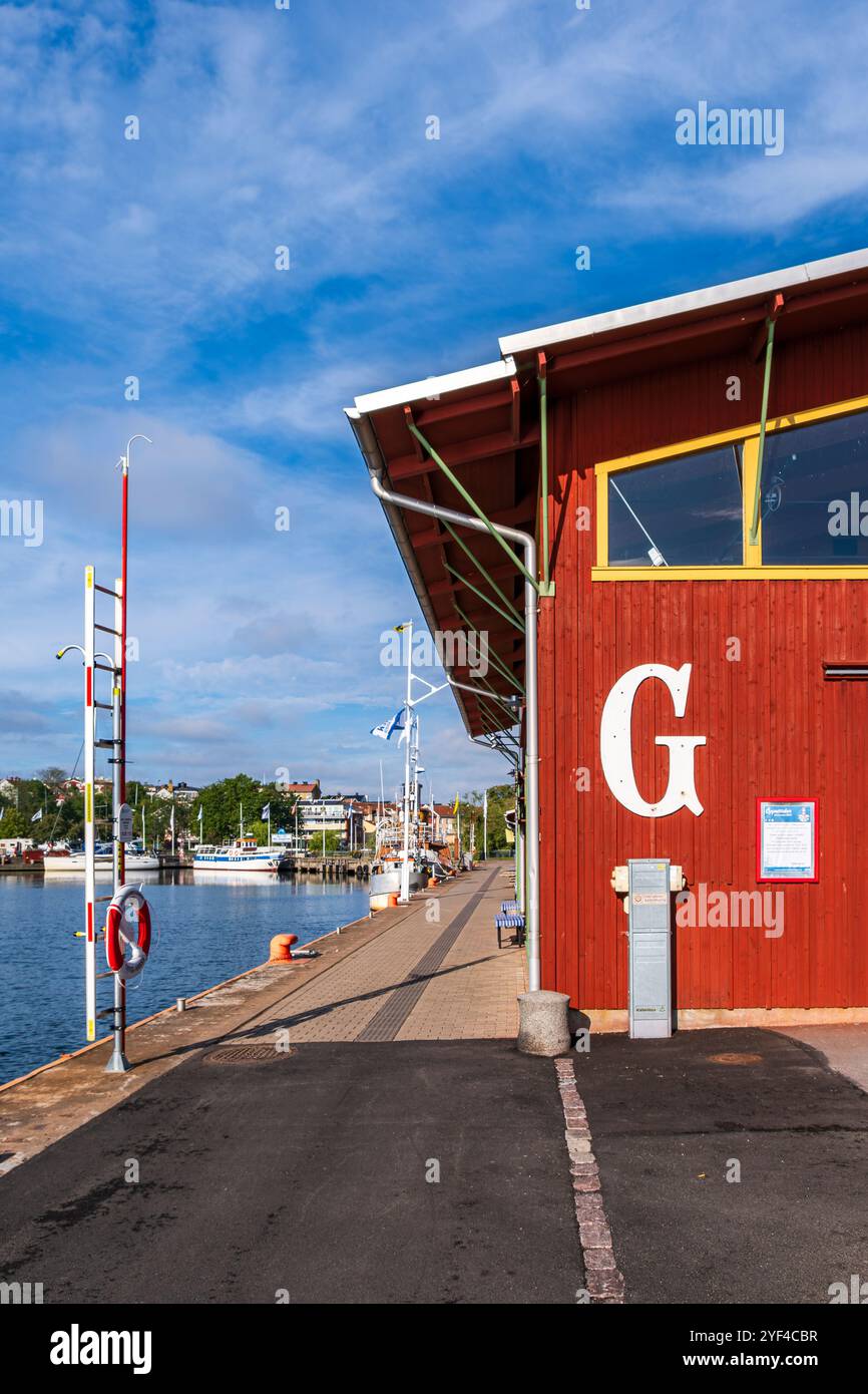 Red harbour building with the letter G in the harbour of Oskarshamn ...