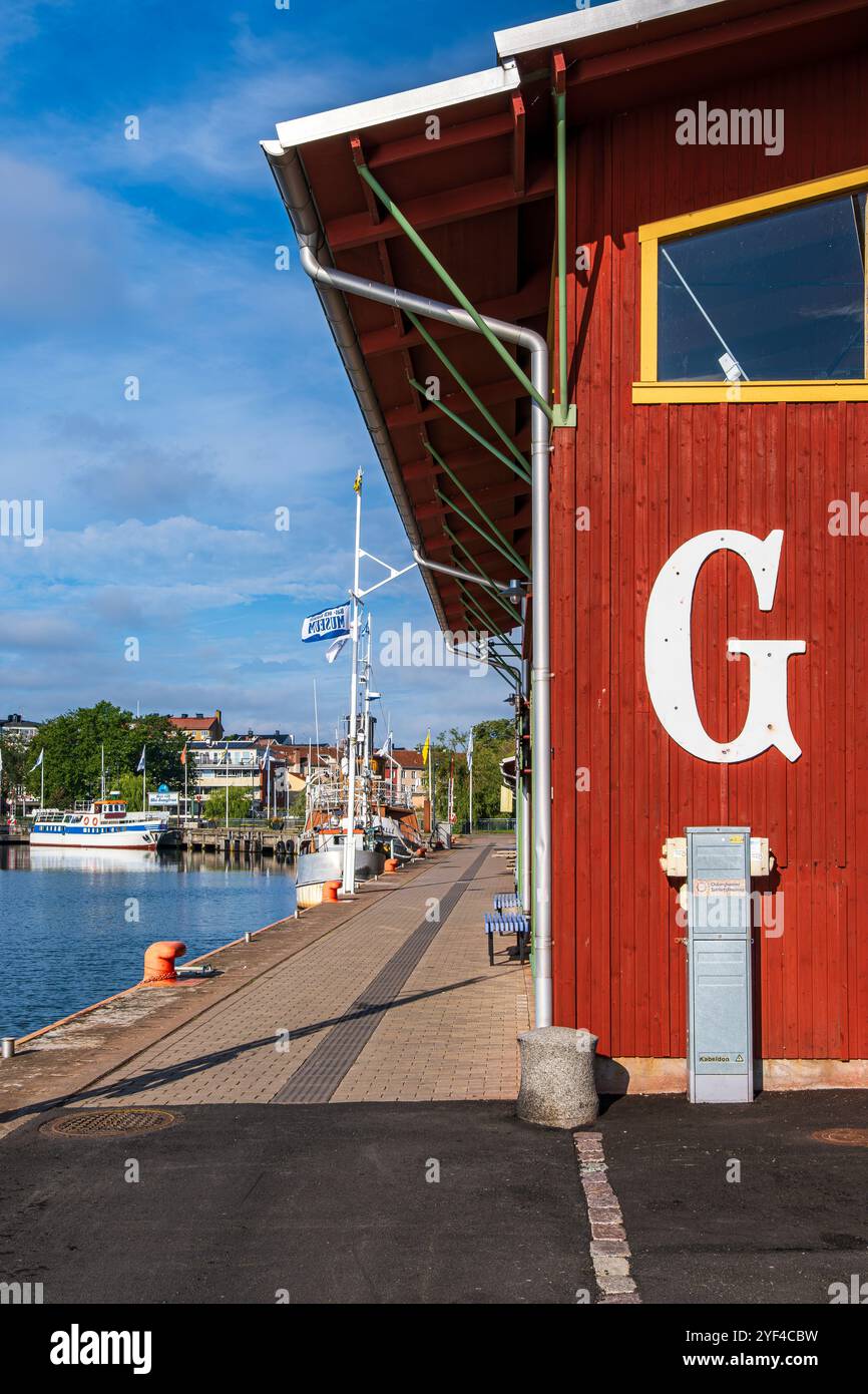 Red harbour building with the letter G in the harbour of Oskarshamn ...