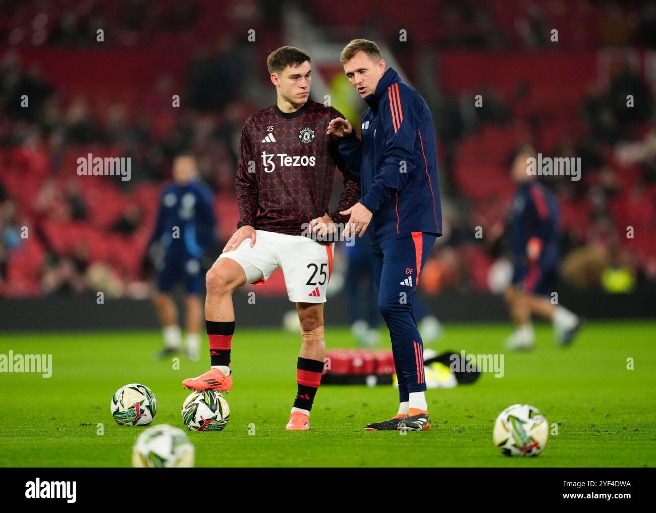 Manchester United coach Darren Fletcher speaks to Manuel Ugarte before ...