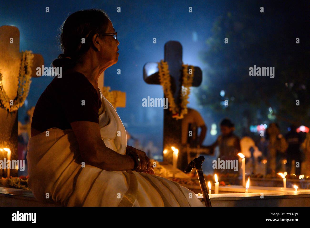 All Souls Day commemoration in Kolkata, India An Indian woman sits near ...