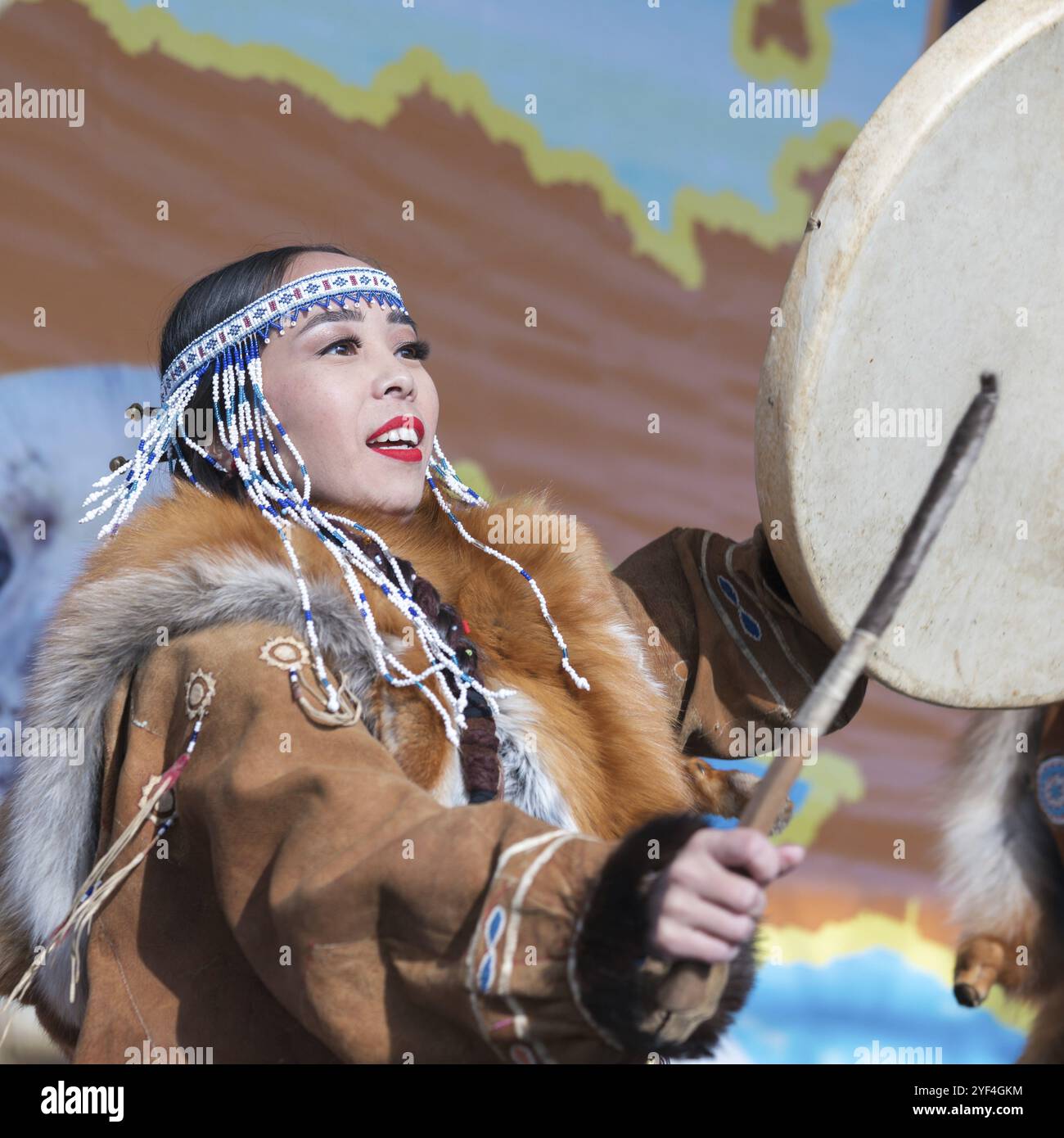 Woman in national clothing indigenous inhabitants Kamchatka dancing ...