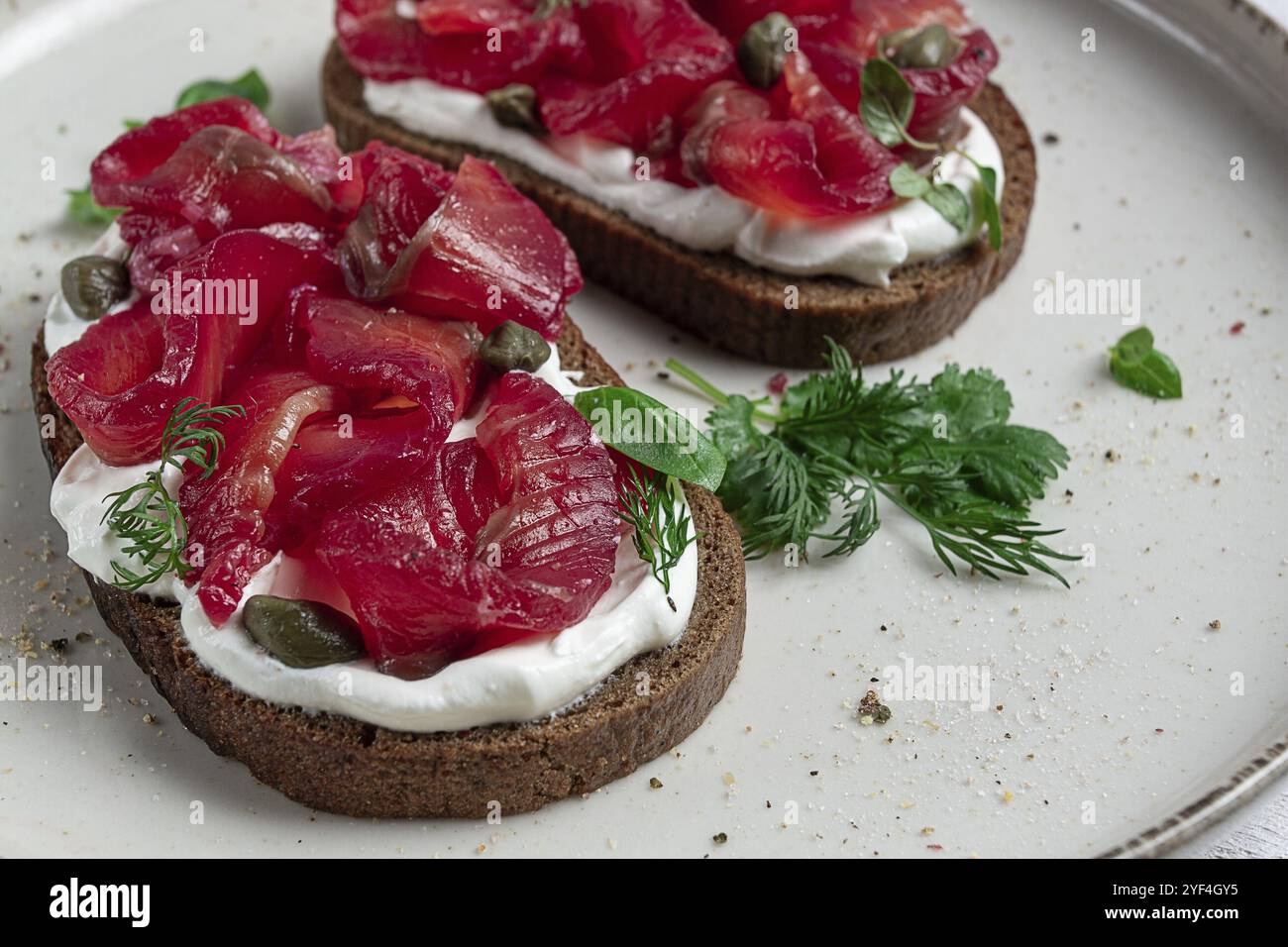 Sandwiches with gravlax salmon, cream cheese, capers, greens, breakfast ...
