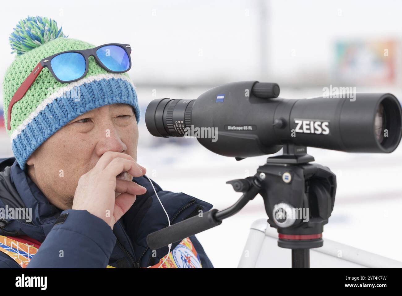 Coach of South Korea biathlon team watches biathletes in monocle at ...