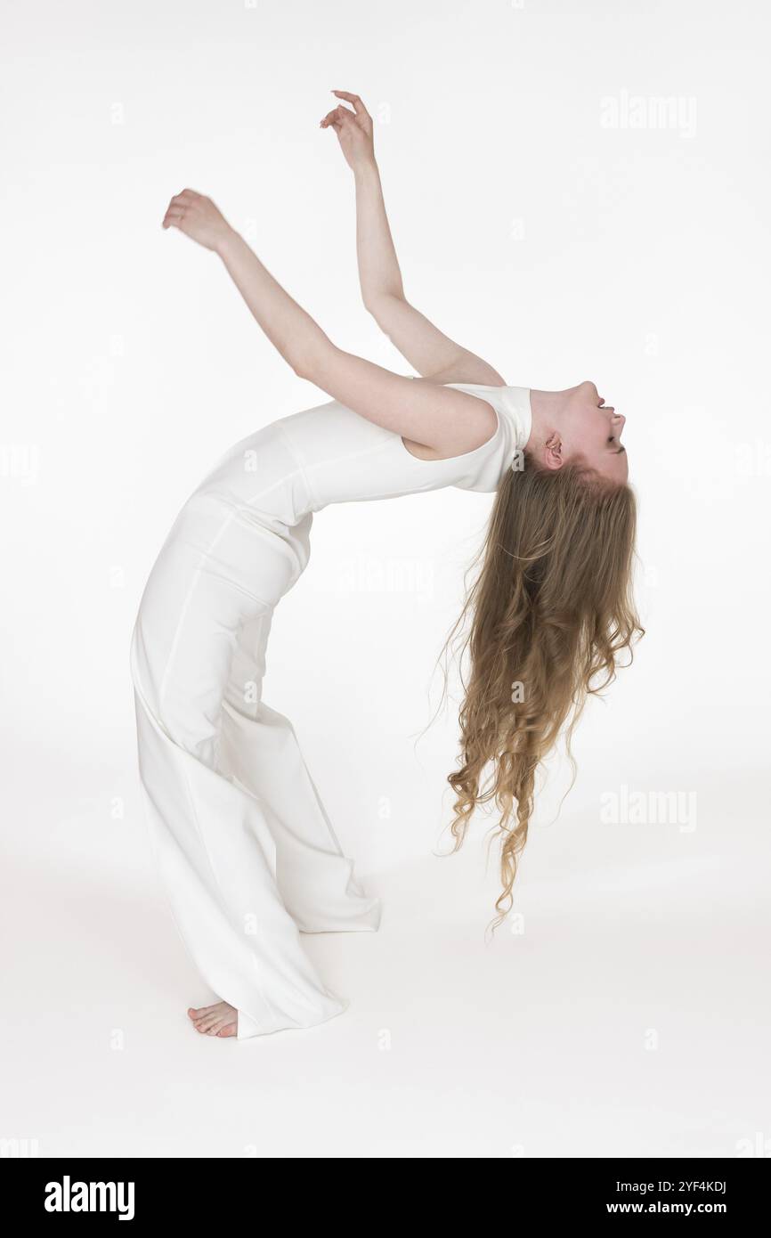 Full length shot barefoot young woman with eyes closed having fun while ...