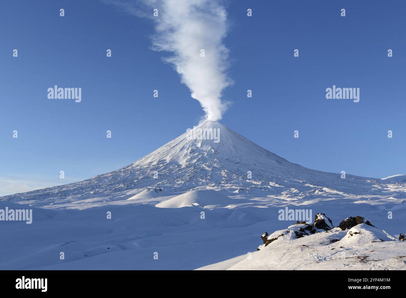 Winter volcanic landscape of Kamchatka Peninsula: view of eruption ...