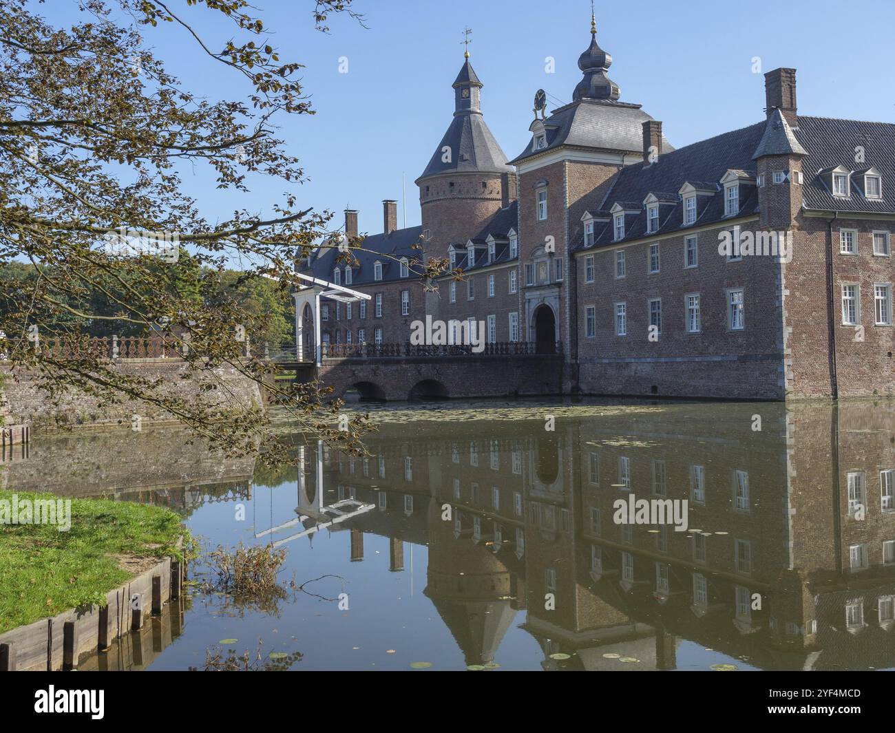 Historic castle with towers and a moat in which the building is ...