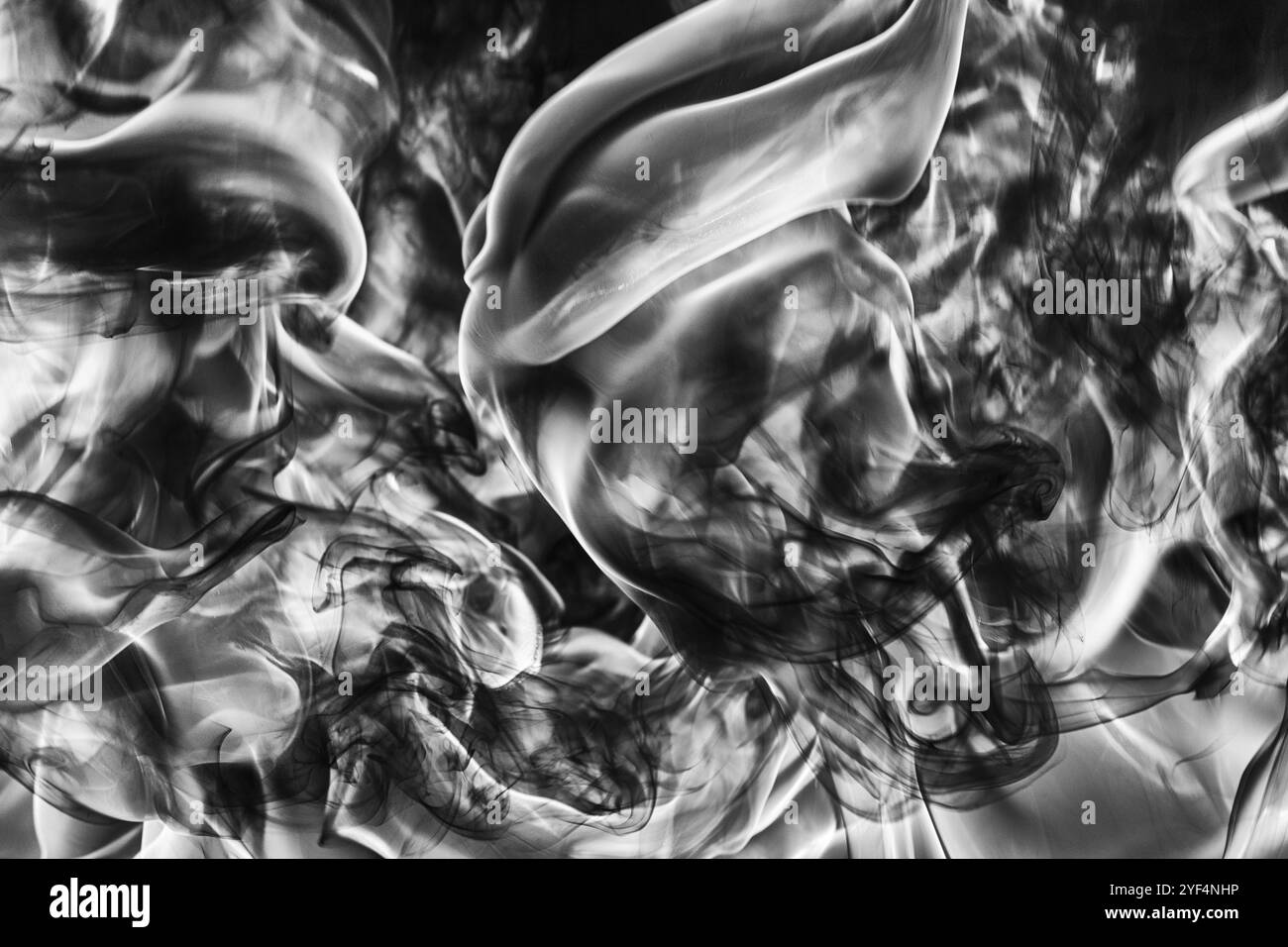 Abstract plume of natural black smoke and white huge flame of strong ...