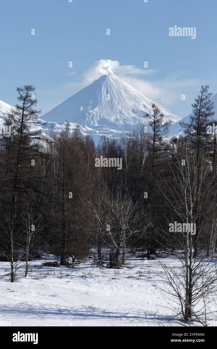 Wintry volcano landscape of Kamchatka Peninsula: view of cone of ...