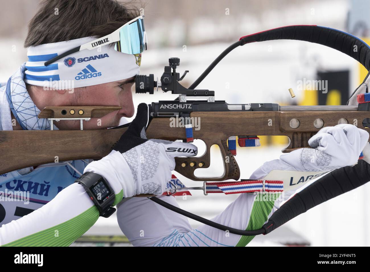 Close-up view sportsman biathlete Ziganchin Rafael rifle shooting in ...