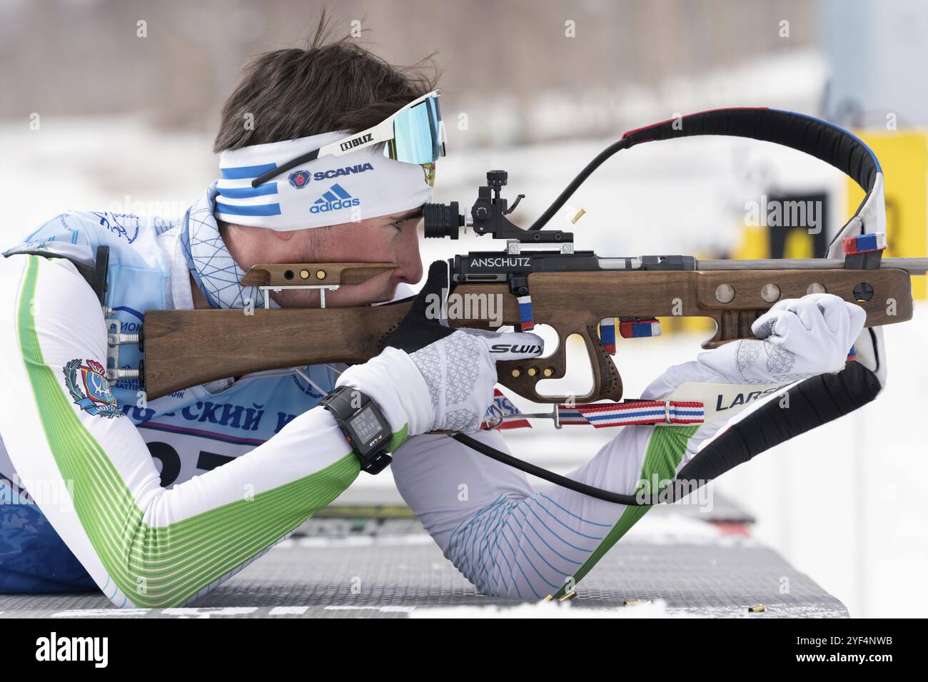 Russian sportsman biathlete Rafael Ziganchin aiming rifle shooting in ...