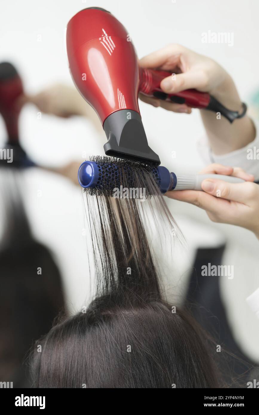 Hairdresser dries hair client dryer hi-res stock photography and images ...