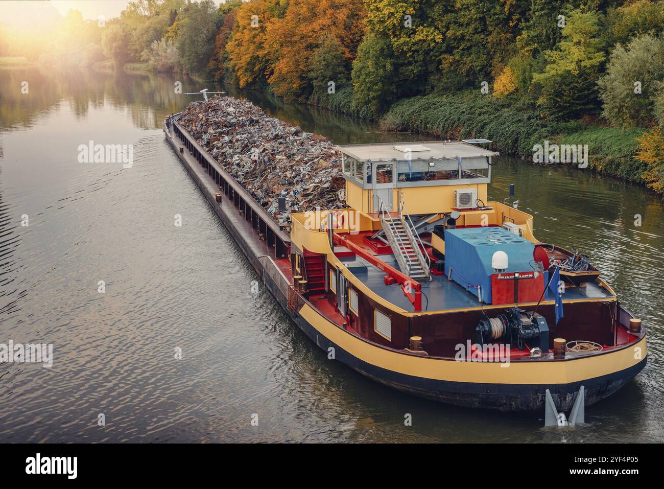 Transportation industry. Ship barge transports scrap metal and sand ...