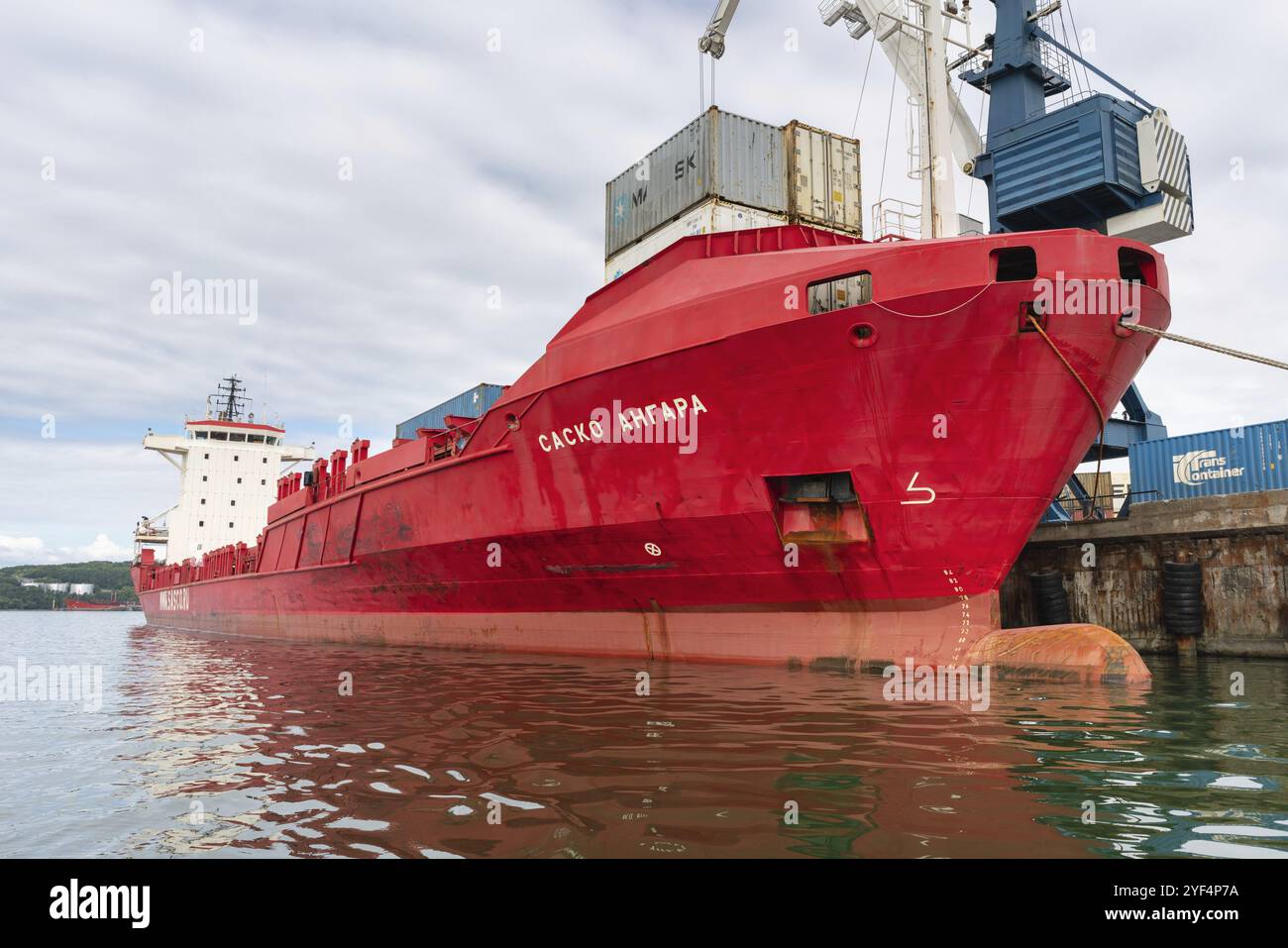 Portal crane unloads Russian cargo container ship Sasco Angara Sakhalin ...