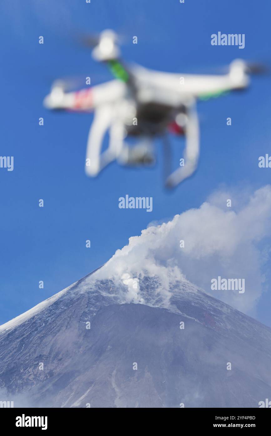 Flying UAV drone quadcopter aerial photography in sky on background ...