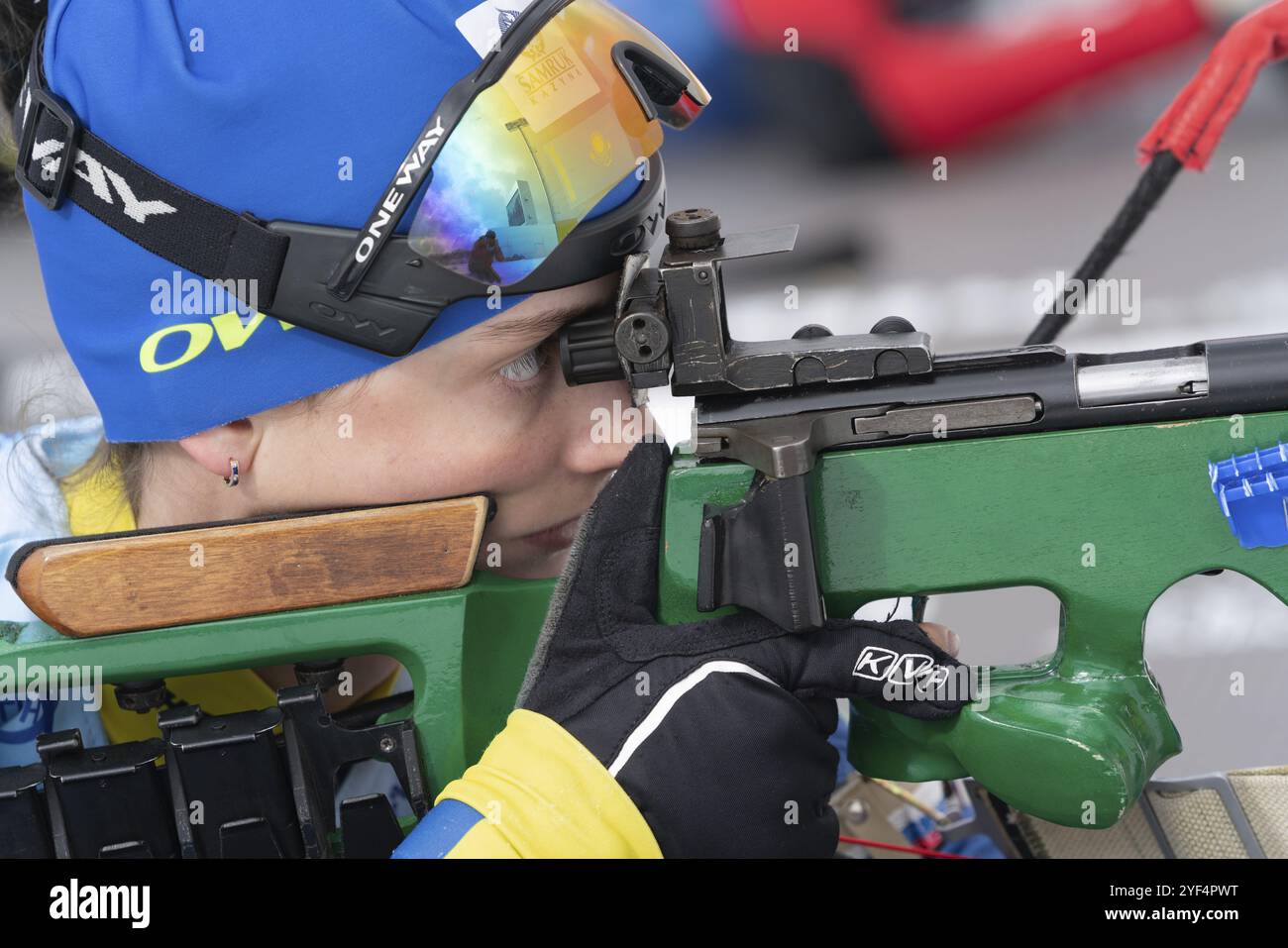 Close-up view of biathlete Arina Kryukova Kazakhstan rifle shooting in ...