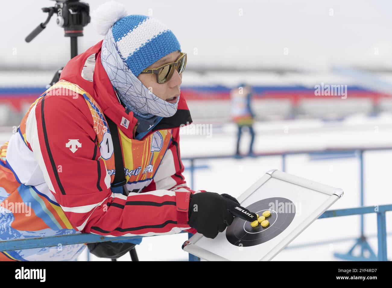 Coach of South Korea biathlon team instructs biathletes at shooting ...