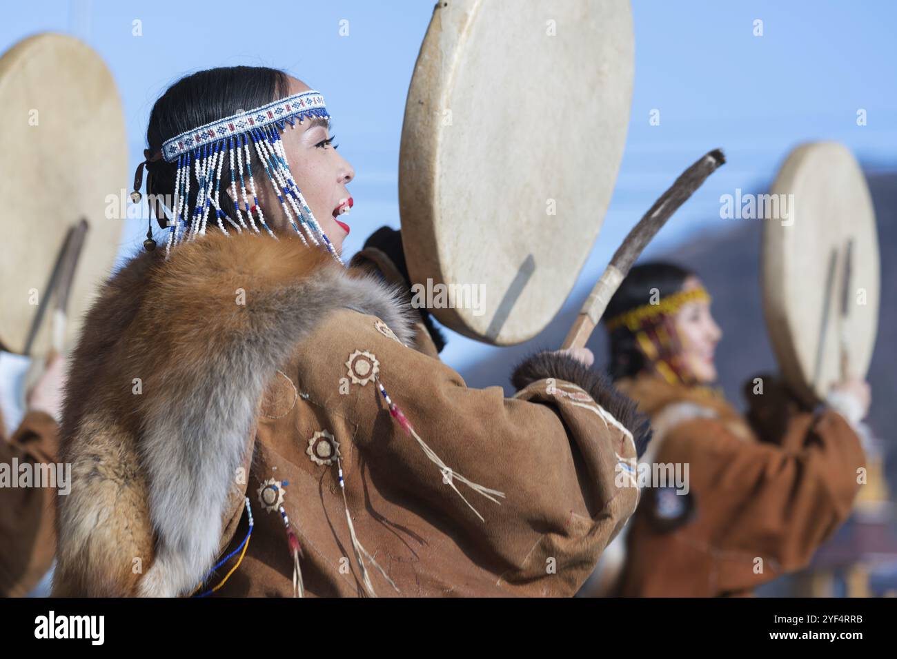 Female dancing with tambourine in national clothing indigenous ...