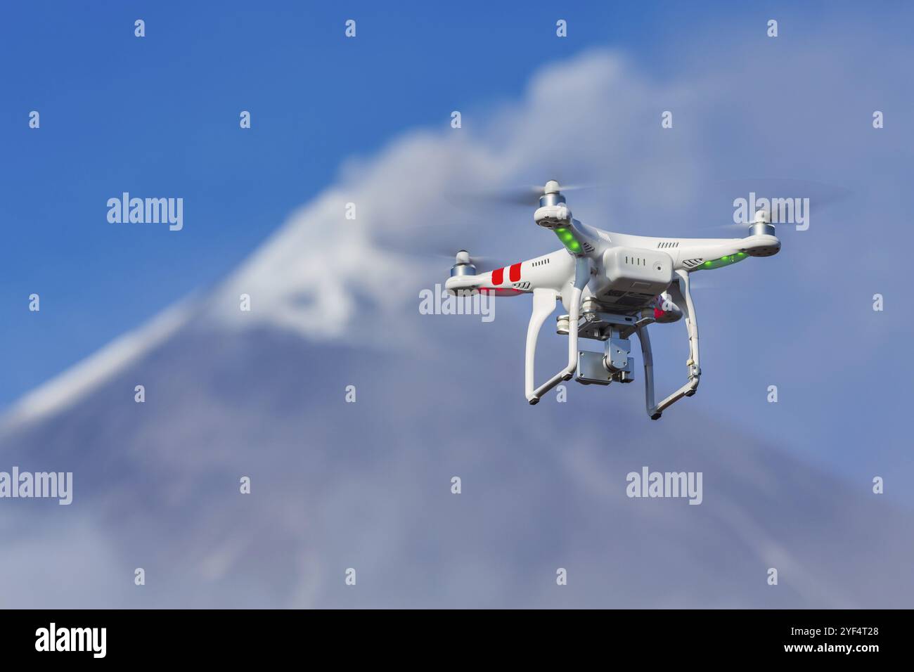 Flying drone quadcopter UAV aerial photography in sky on background ...