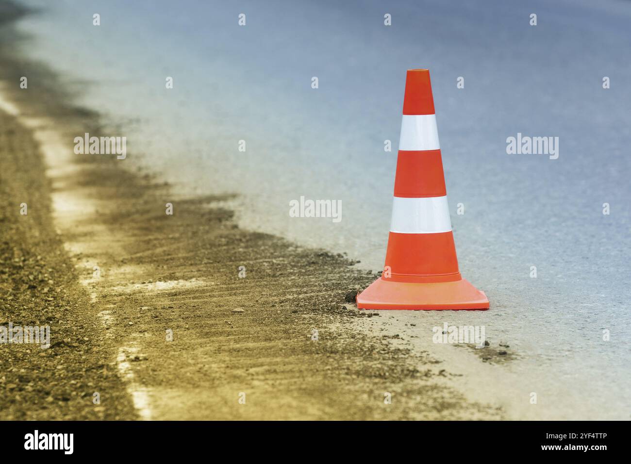 Warning traffic road cone stand on street asphalt city road during road ...