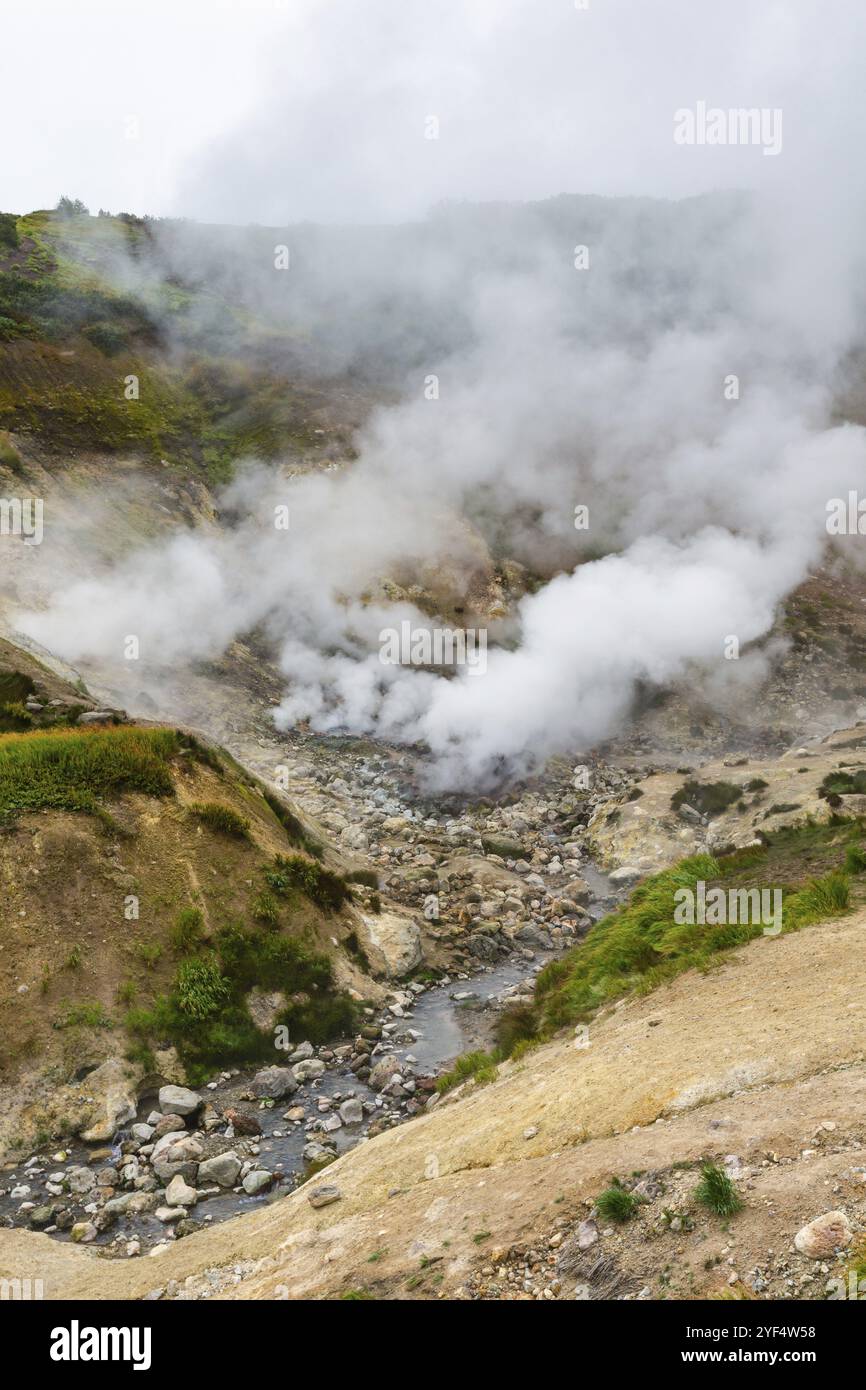 Exciting view of volcanic landscape, eruption fumarole, aggressive hot ...