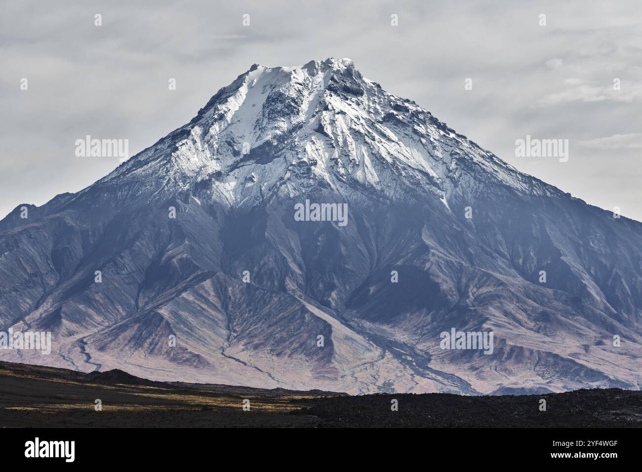 Beautiful autumn volcanic landscape, view of snow-capped cone of ...