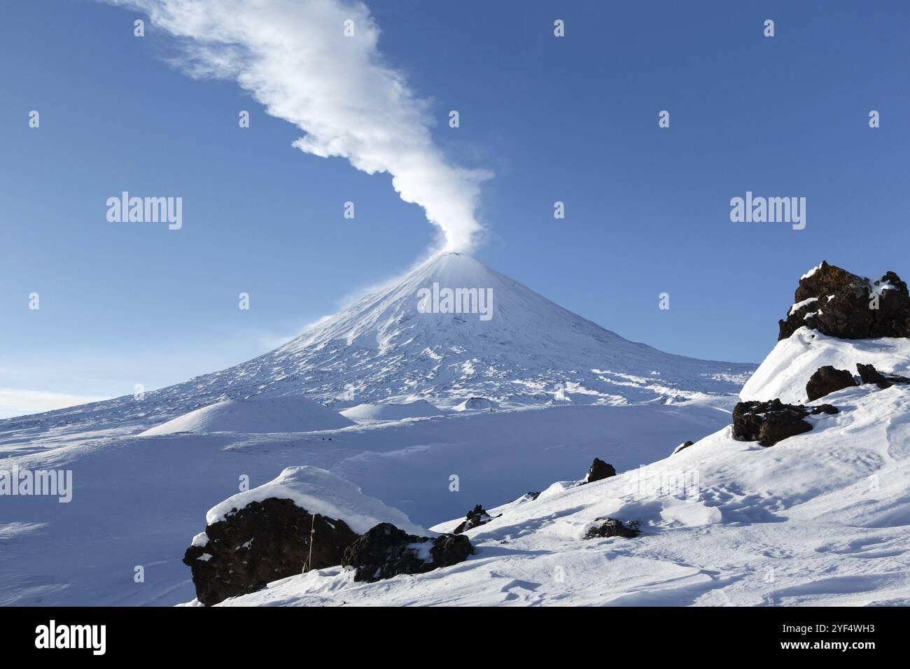 Beautiful winter volcanic landscape of Kamchatka: view of eruption ...