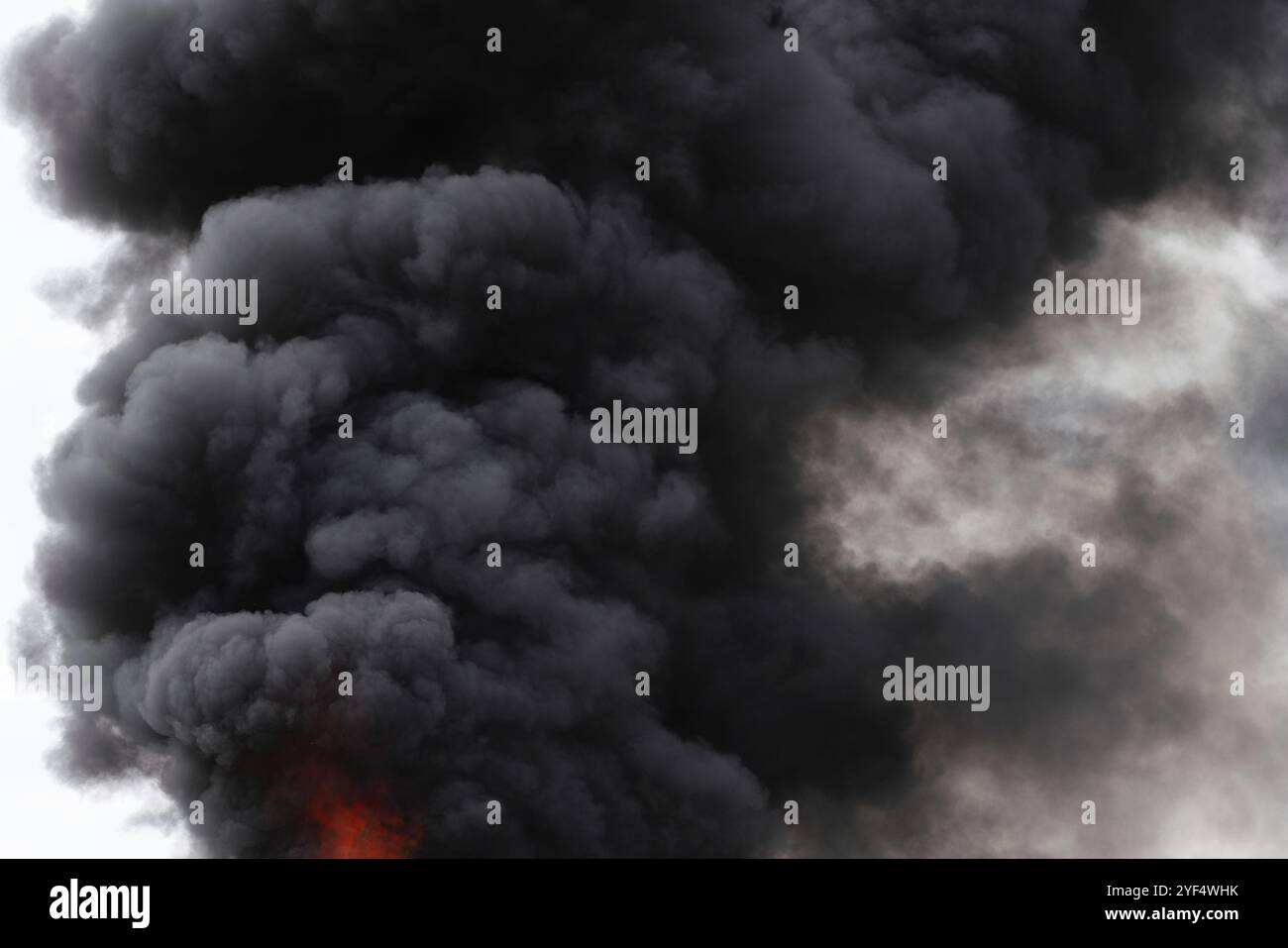 Black motion clouds of strong fire smoke covered sky. Defocus and ...