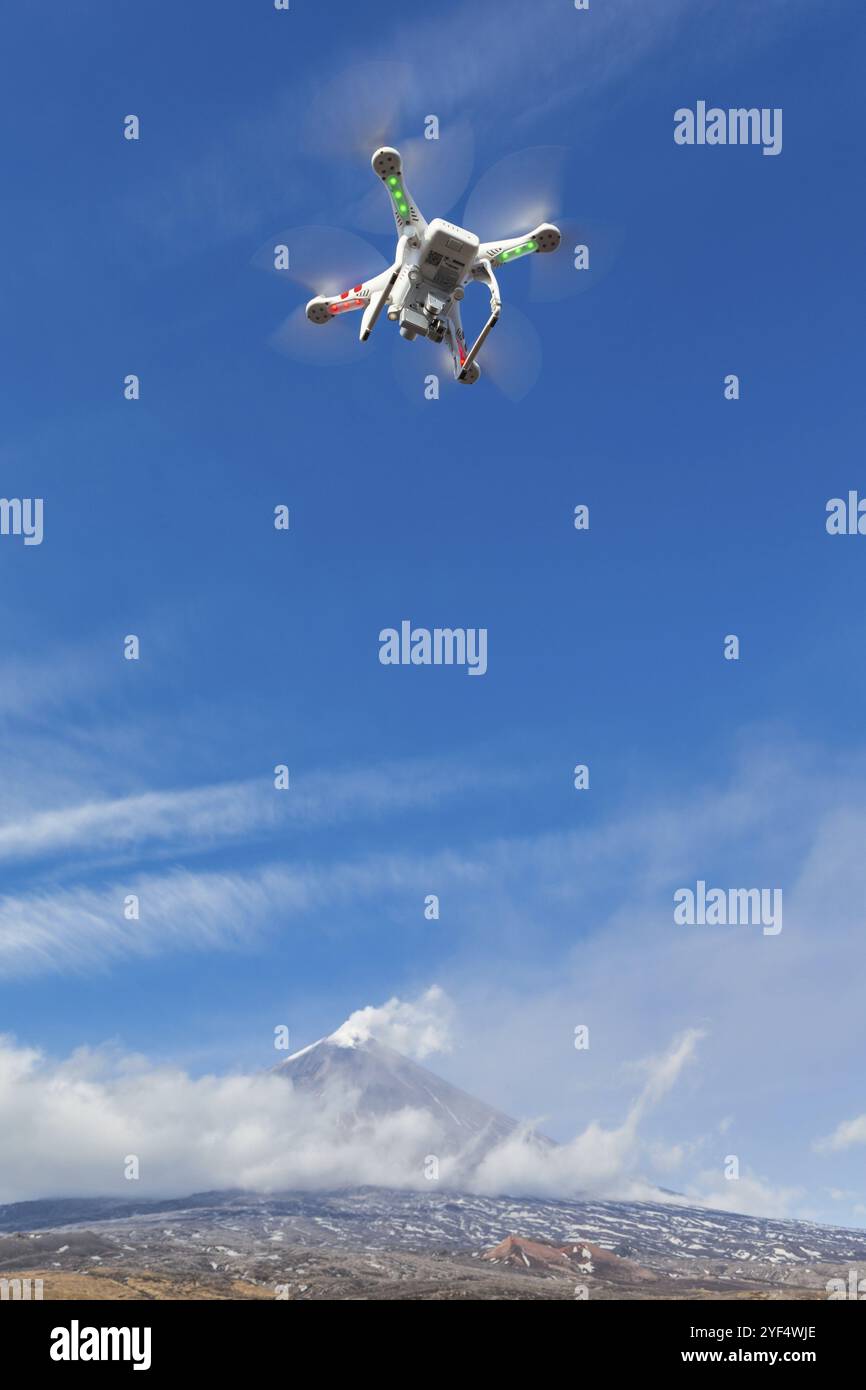 Flying drone quadcopter UAV aerial videography in sky on background of ...