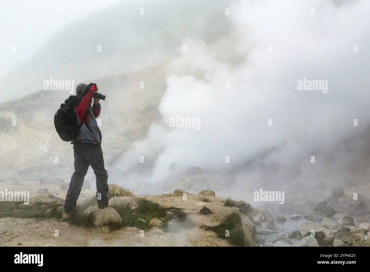 Male photographer takes pictures of mysterious volcanic landscape ...