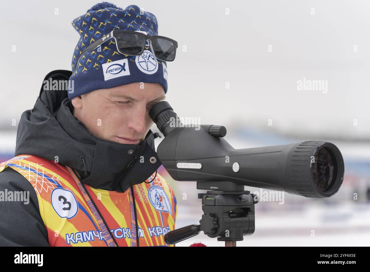 Coach of Russian biathlon team watches biathletes in monocle at ...