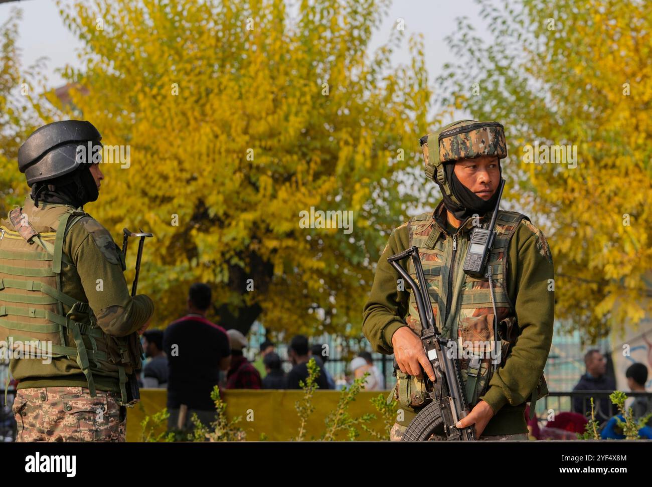 Indian paramilitary soldiers guard at the site of a grenade explosion ...