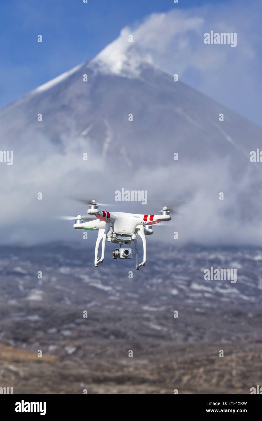 Flying drone quadcopter UAV aerial photography in sky on background of ...