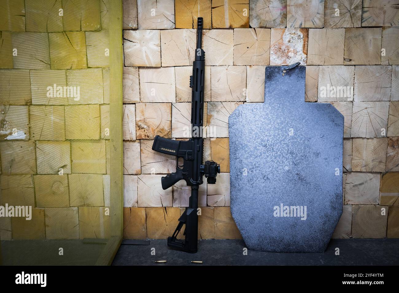 M4 rifle with thermal imaging sight at a shooting range with a metal ...