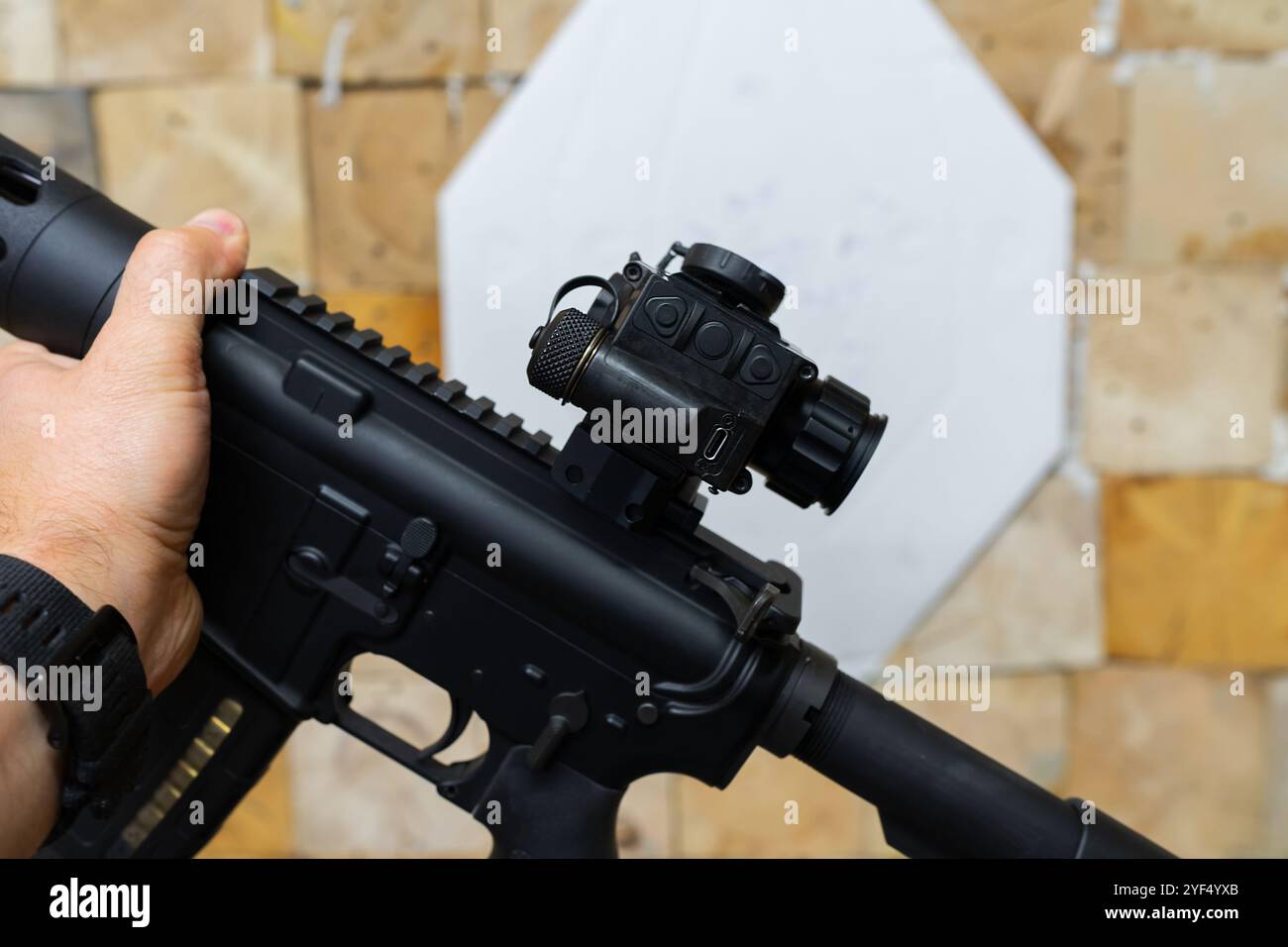 American rifle with thermal imaging sight at a shooting range, close-up ...