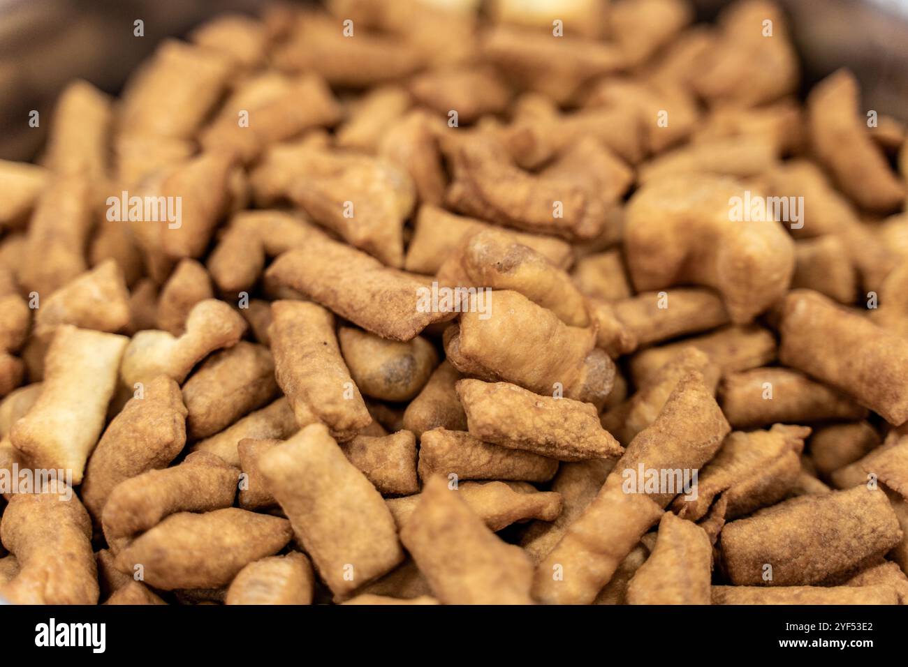 Sticks or strips of dough fried in pieces in a frying pan in oil (Pa ...